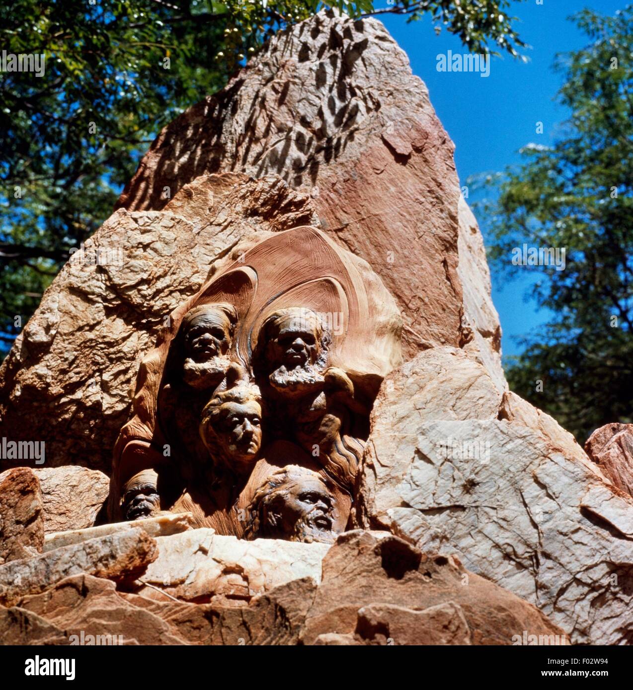 Aboriginal heads carved in a sandstone rock, Kakadu National Park ...