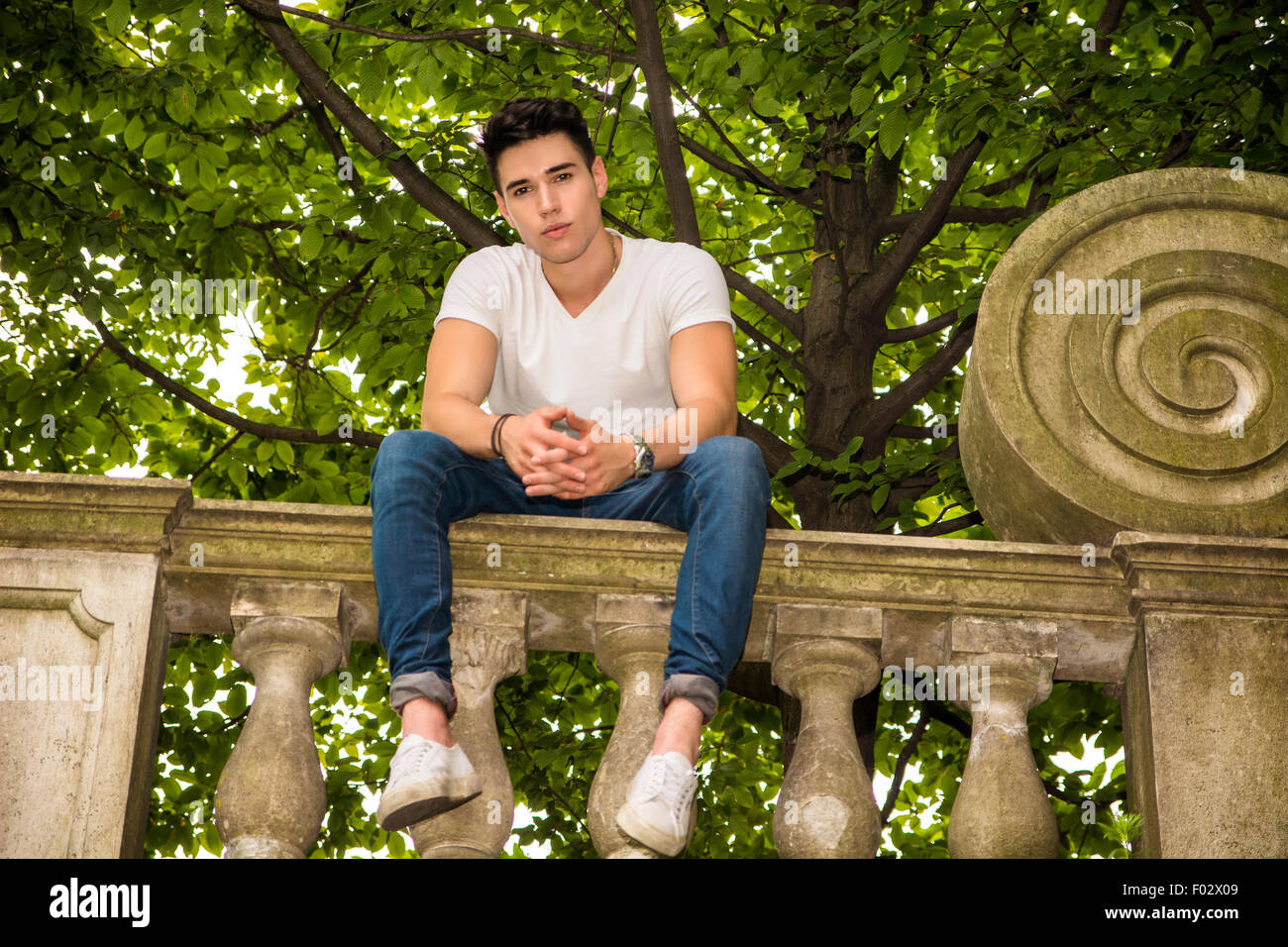Man sitting on balcony hi-res stock photography and images - Alamy