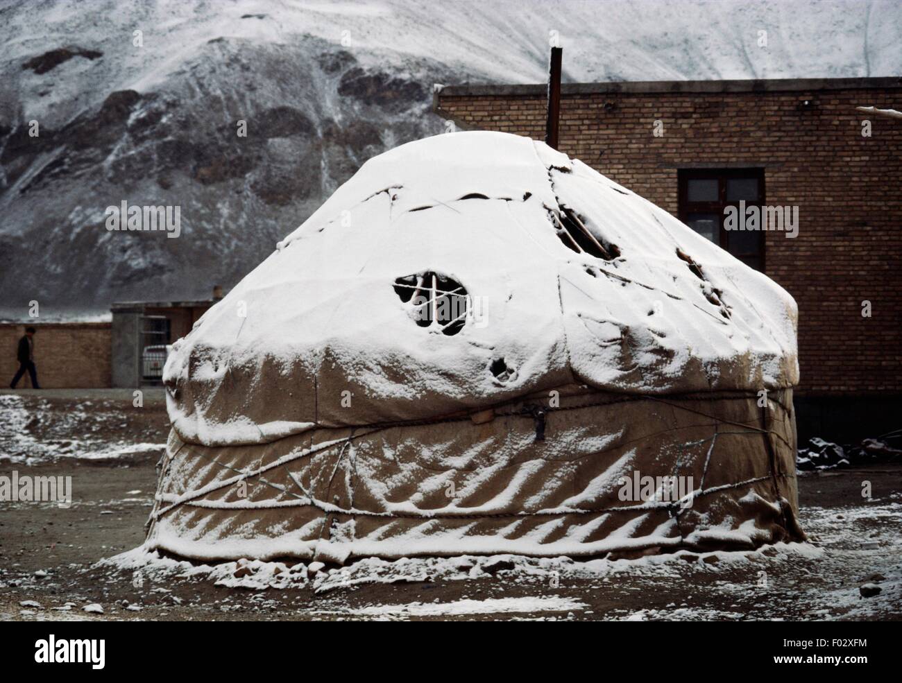 Yurt (home of the nomadic peoples of Asia) covered with snow, Sinkiang ...