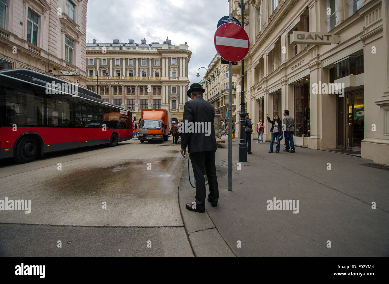 A man cleaning the street in Vienna Stock Photo - Alamy