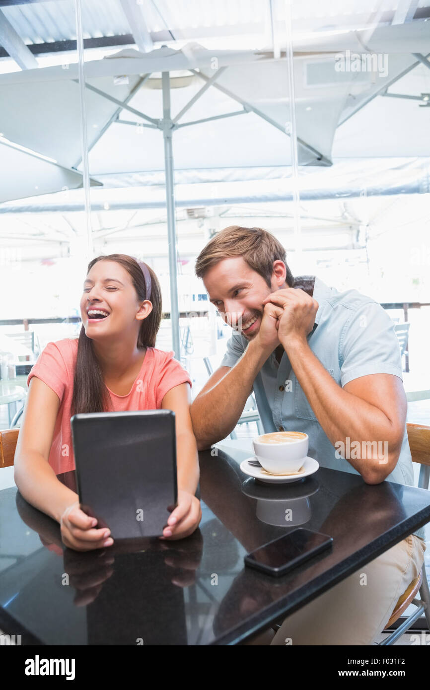 Young happy couple laughing Stock Photo - Alamy