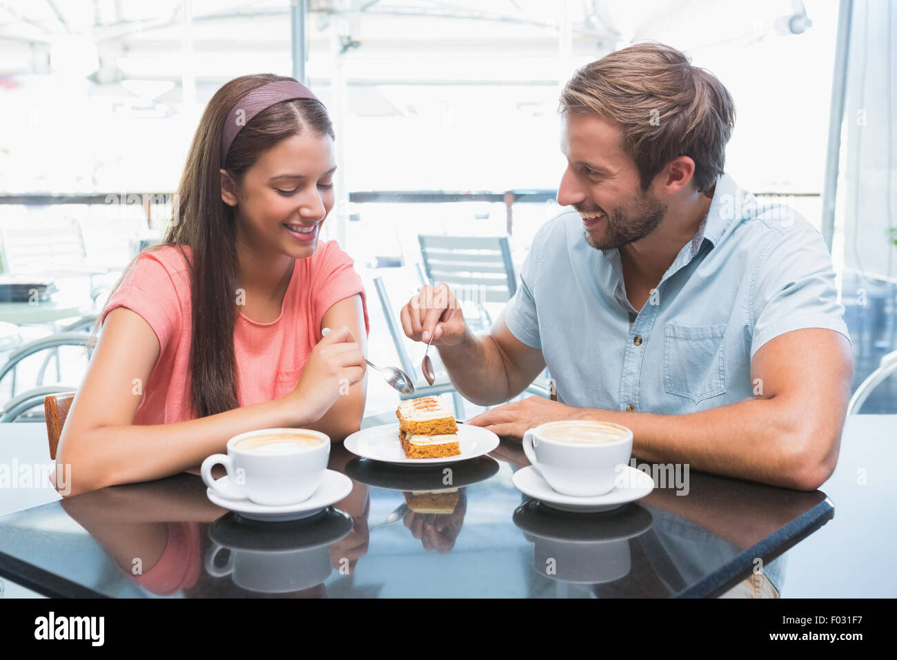Young couple sharing beverage hi-res stock photography and images - Alamy