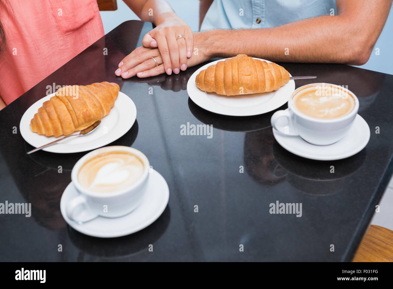 Coffee with hearts and bread with happy couple behind it Stock Photo ...