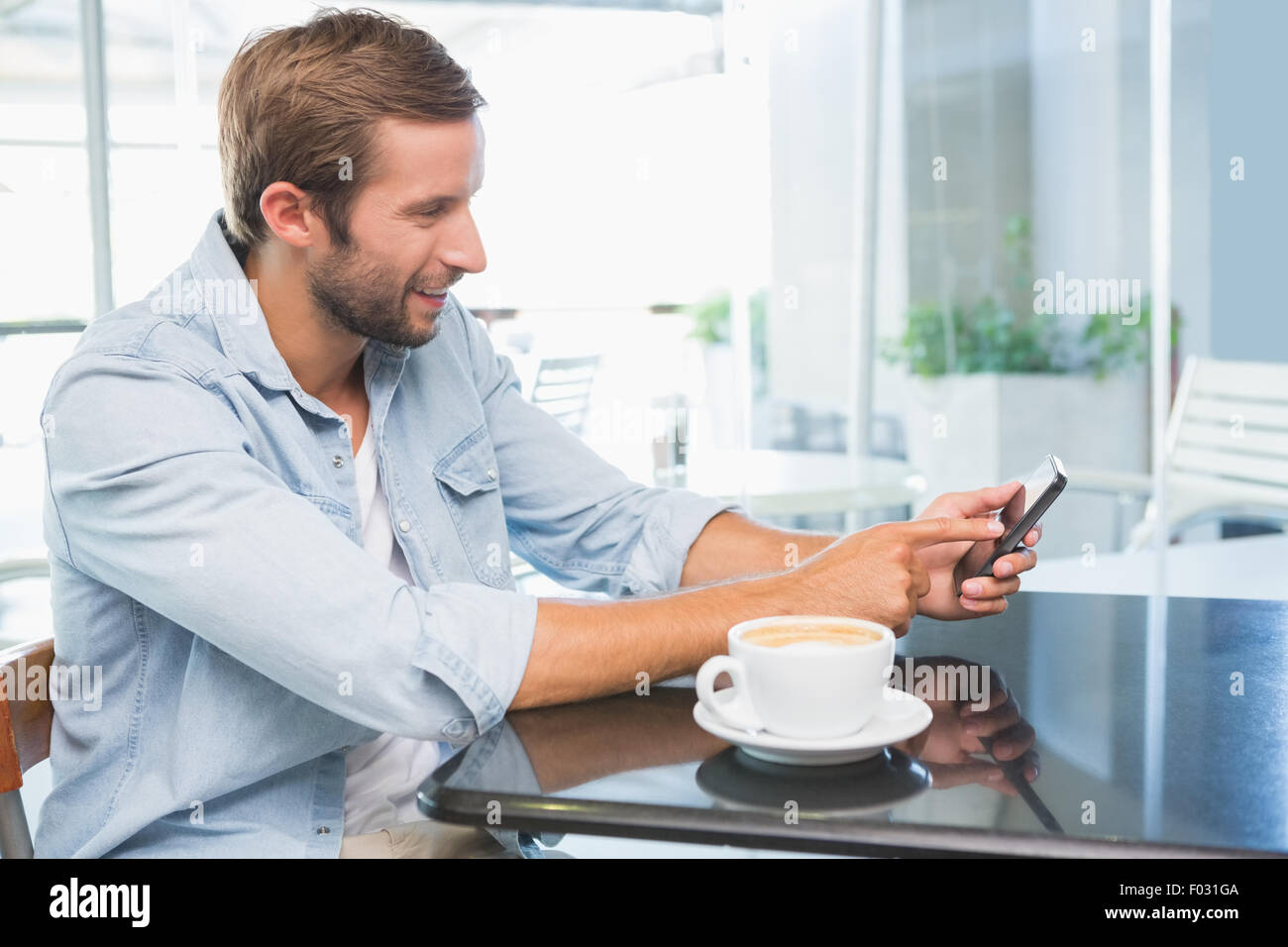 Typing phone hi-res stock photography and images - Alamy