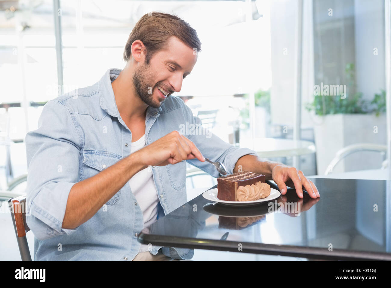 Man eating chocolate hi-res stock photography and images - Alamy
