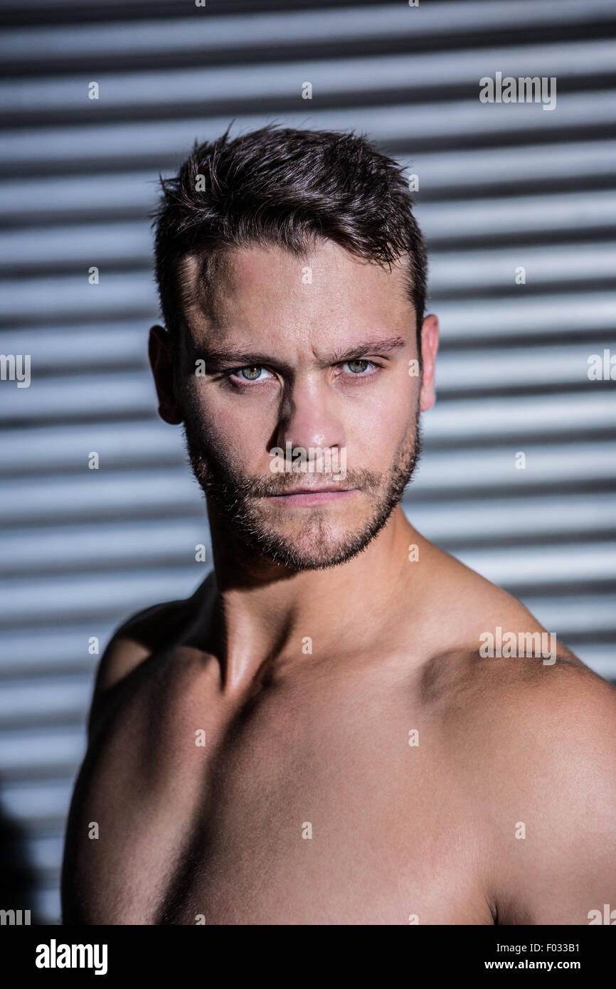 Portrait of serious muscular man looking at camera Stock Photo - Alamy