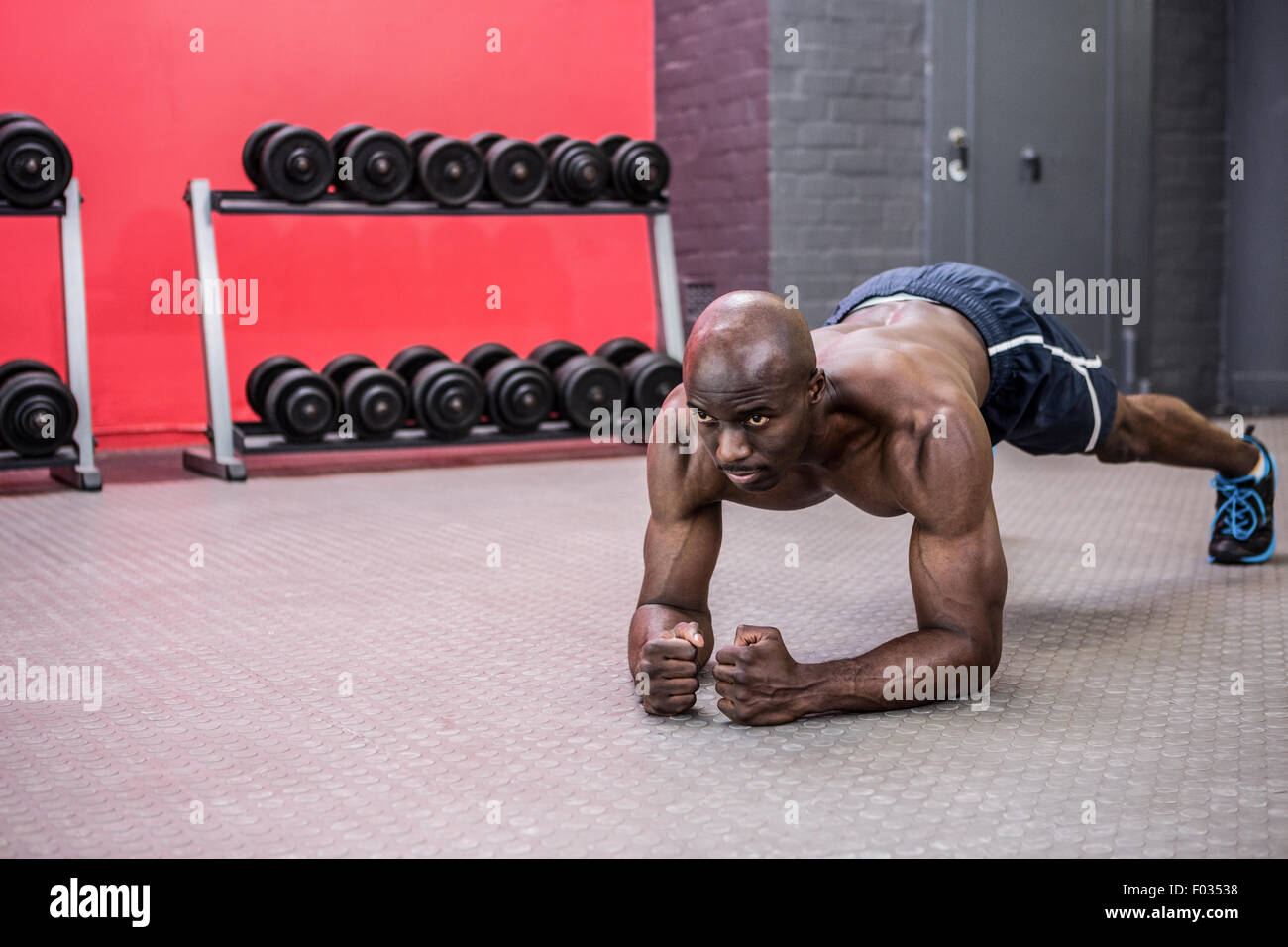 Young bodybuilder doing excercises Stock Photo - Alamy