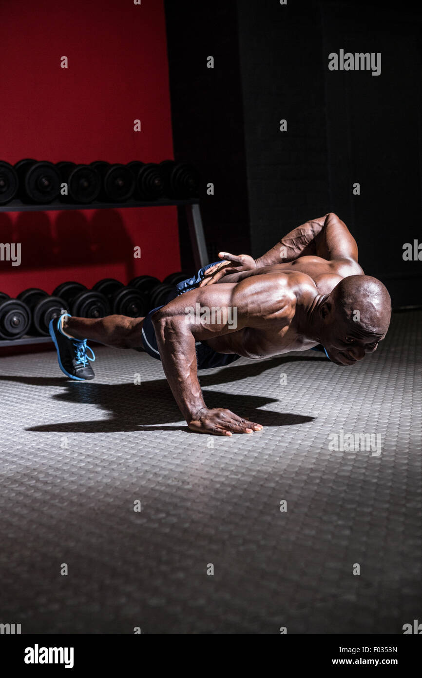 Young Bodybuilder doing One-armed push ups Stock Photo - Alamy