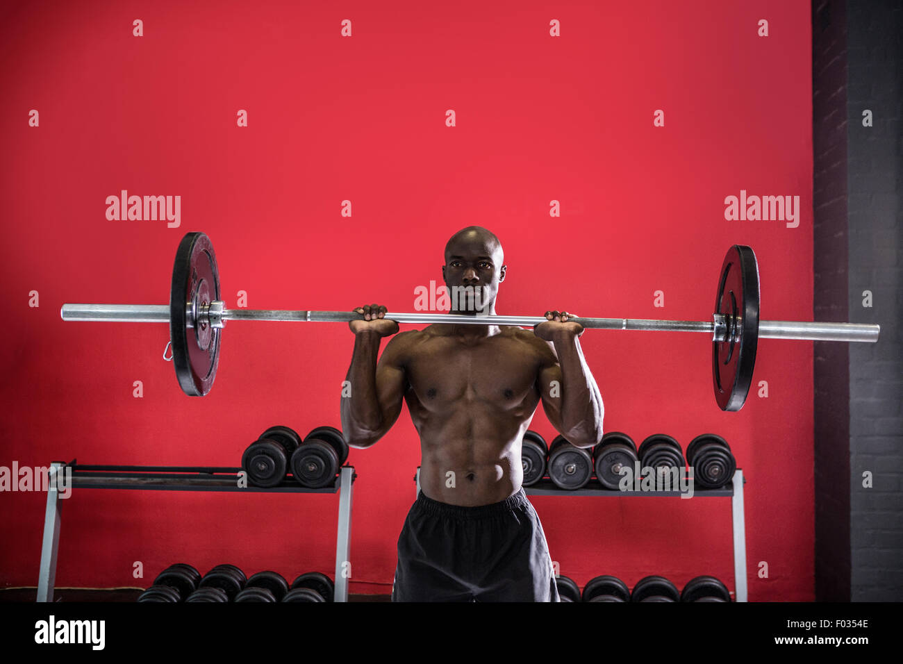 Young Bodybuilder doing weightlifting Stock Photo - Alamy