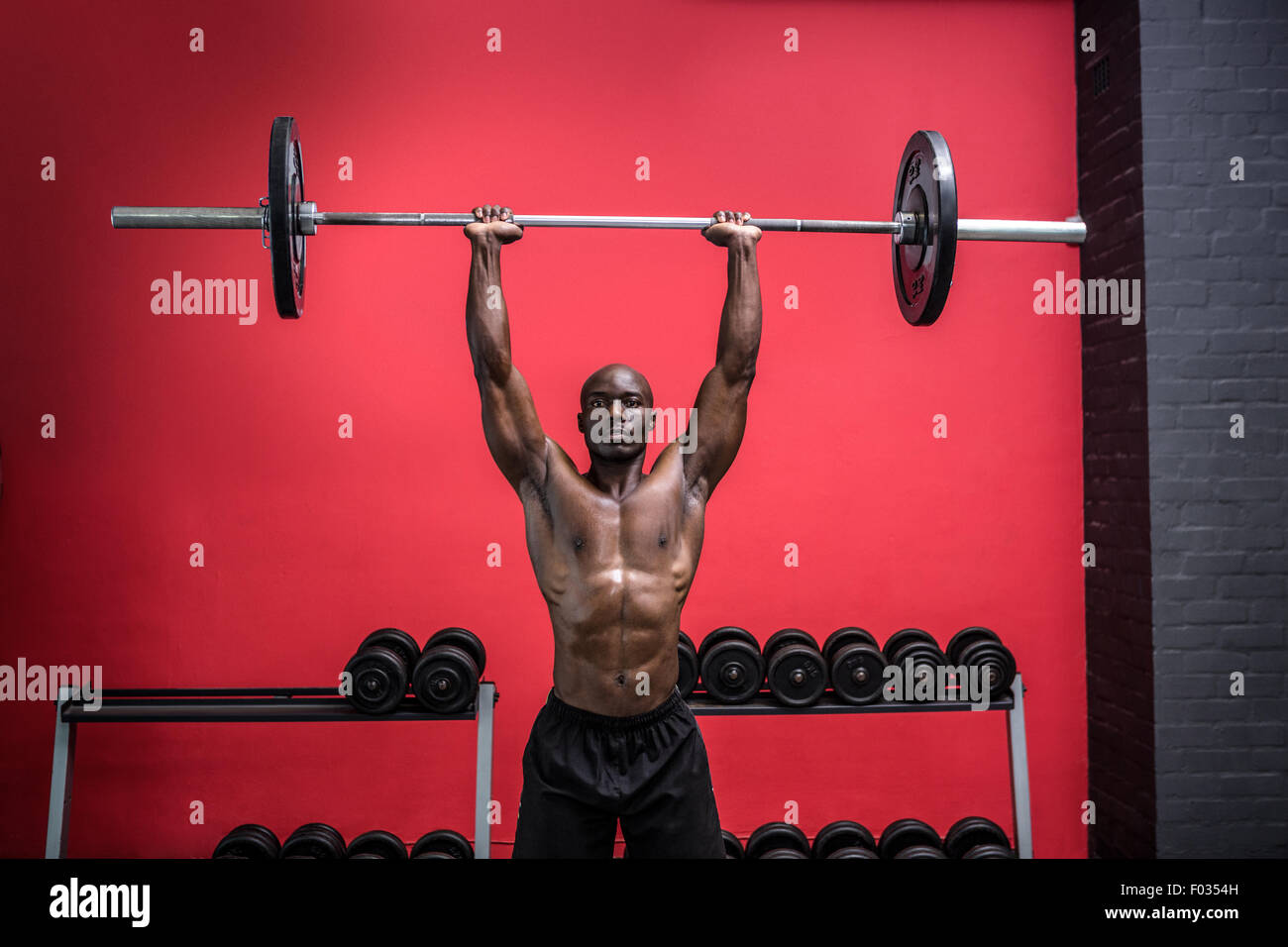 Young Bodybuilder doing weightlifting Stock Photo - Alamy
