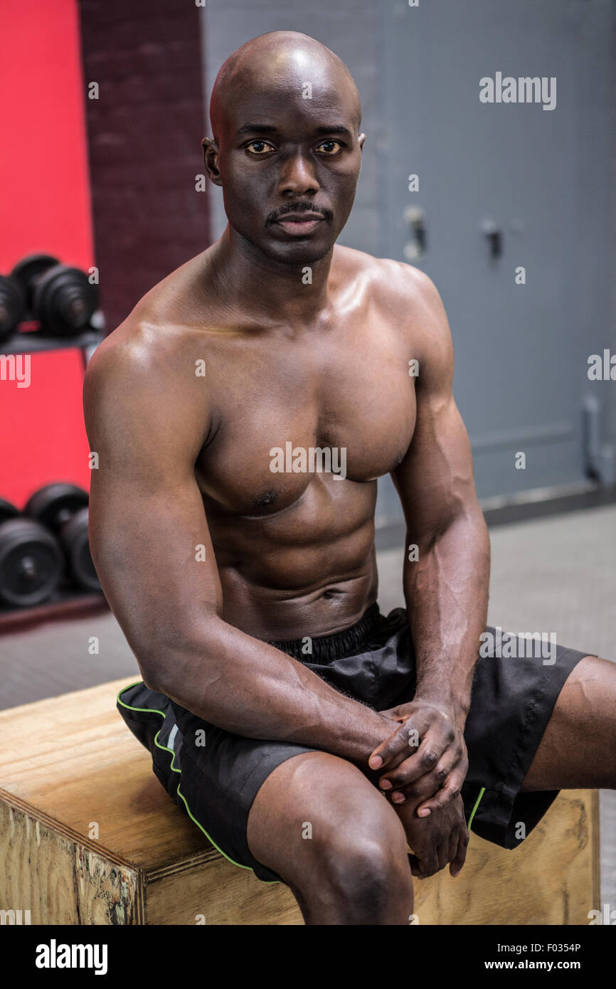 Handsome young bodybuilder sitting hi-res stock photography and images - Alamy