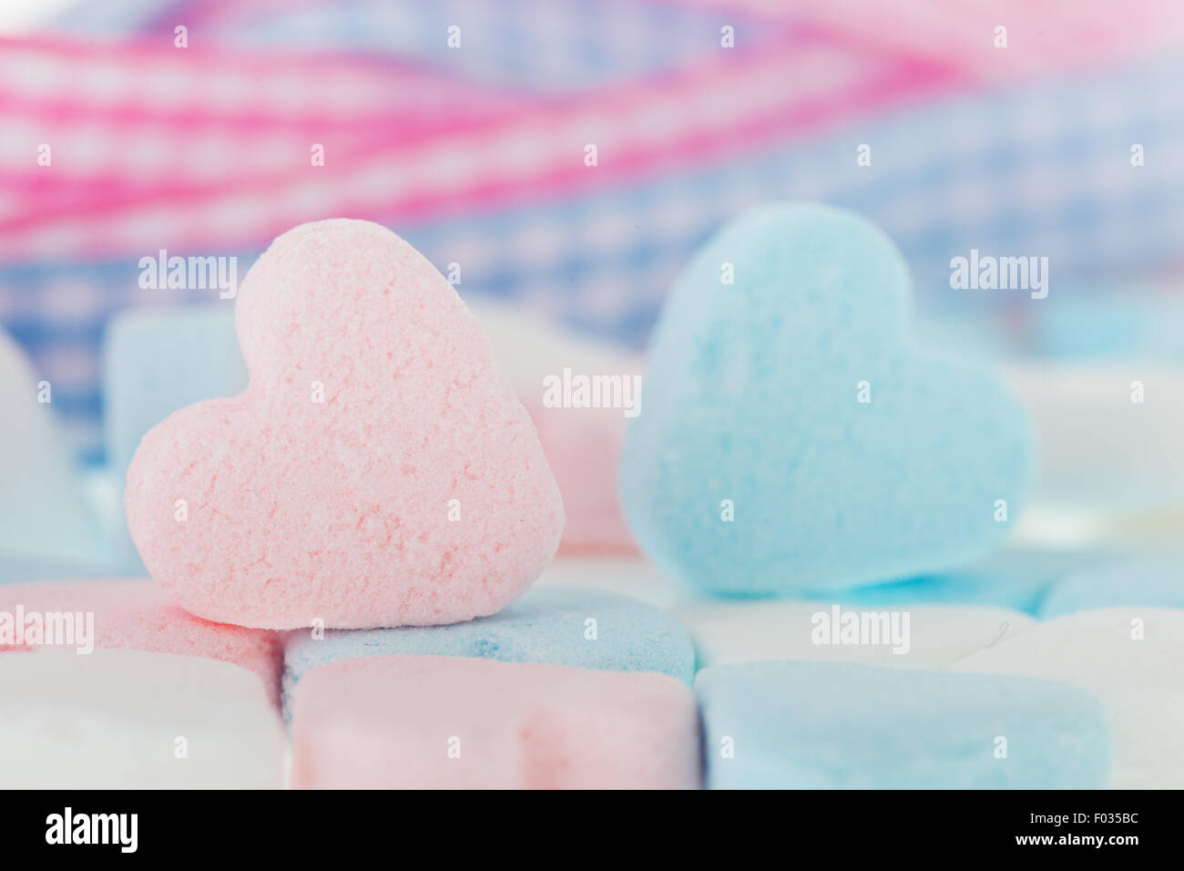 Pink and blue candy hearts for baby card Stock Photo - Alamy