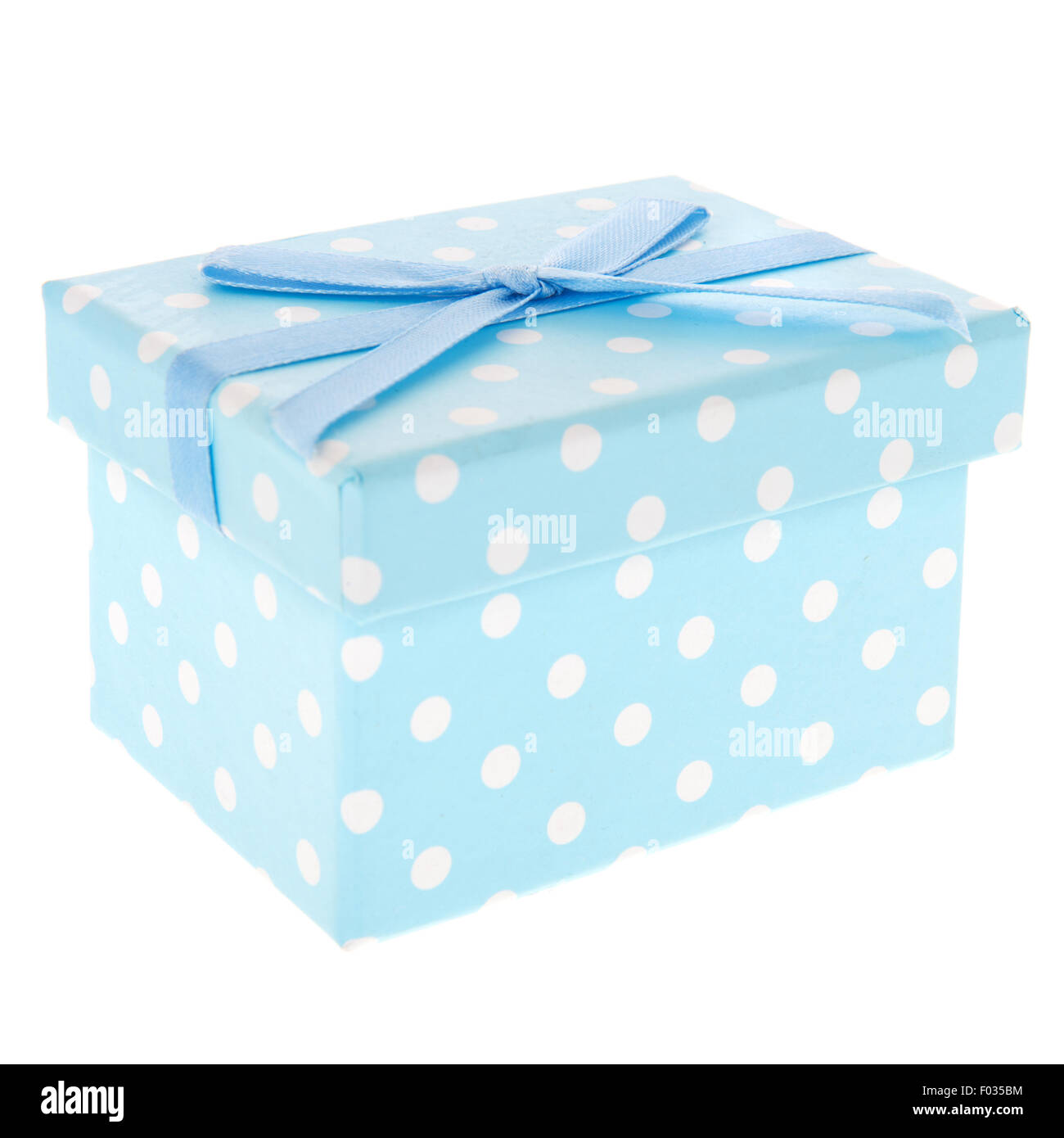 Blue spotted gift box isolated over white background Stock Photo - Alamy