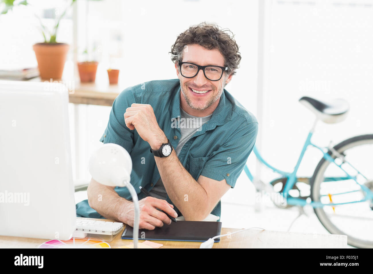 Portrait attractive male designer using hi-res stock photography and ...