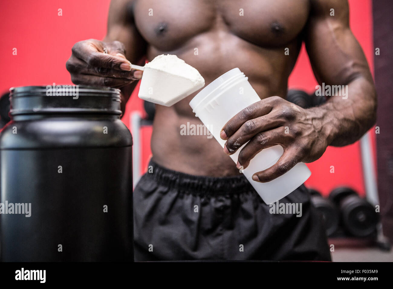 Young Bodybuilder filling his Bottle Stock Photo - Alamy