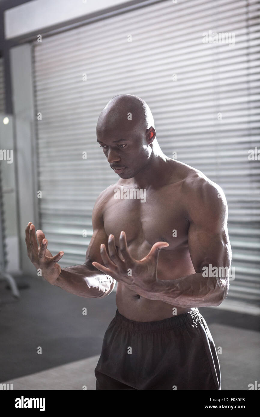 Young Bodybuilder posing in front of the camera Stock Photo - Alamy