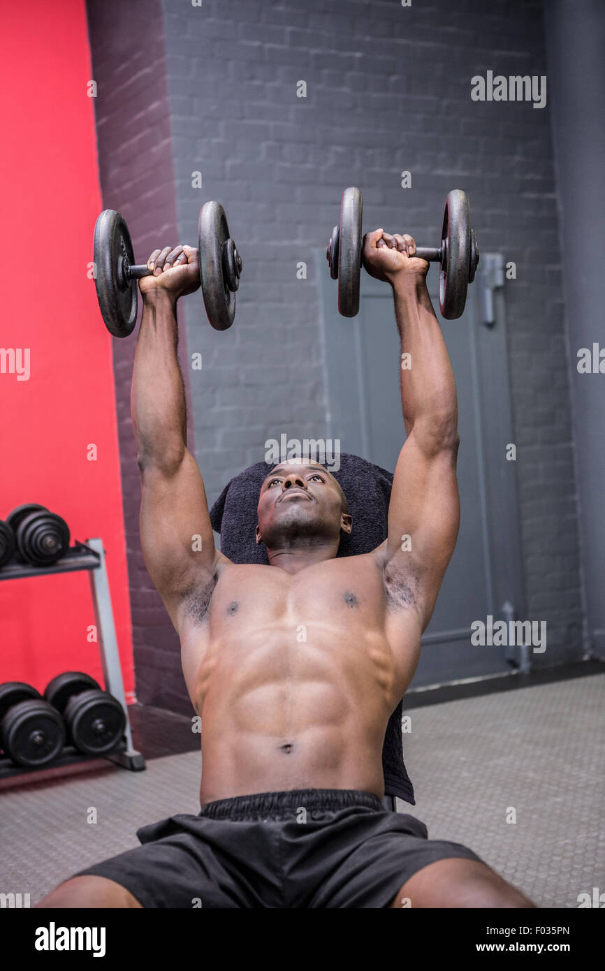 Young Bodybuilder doing weightlifting Stock Photo - Alamy