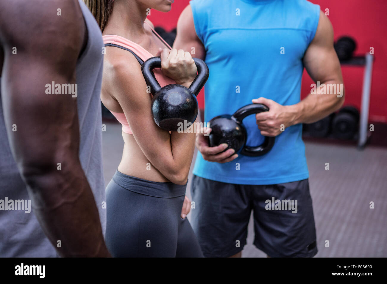Young people lifting weights Stock Photo - Alamy
