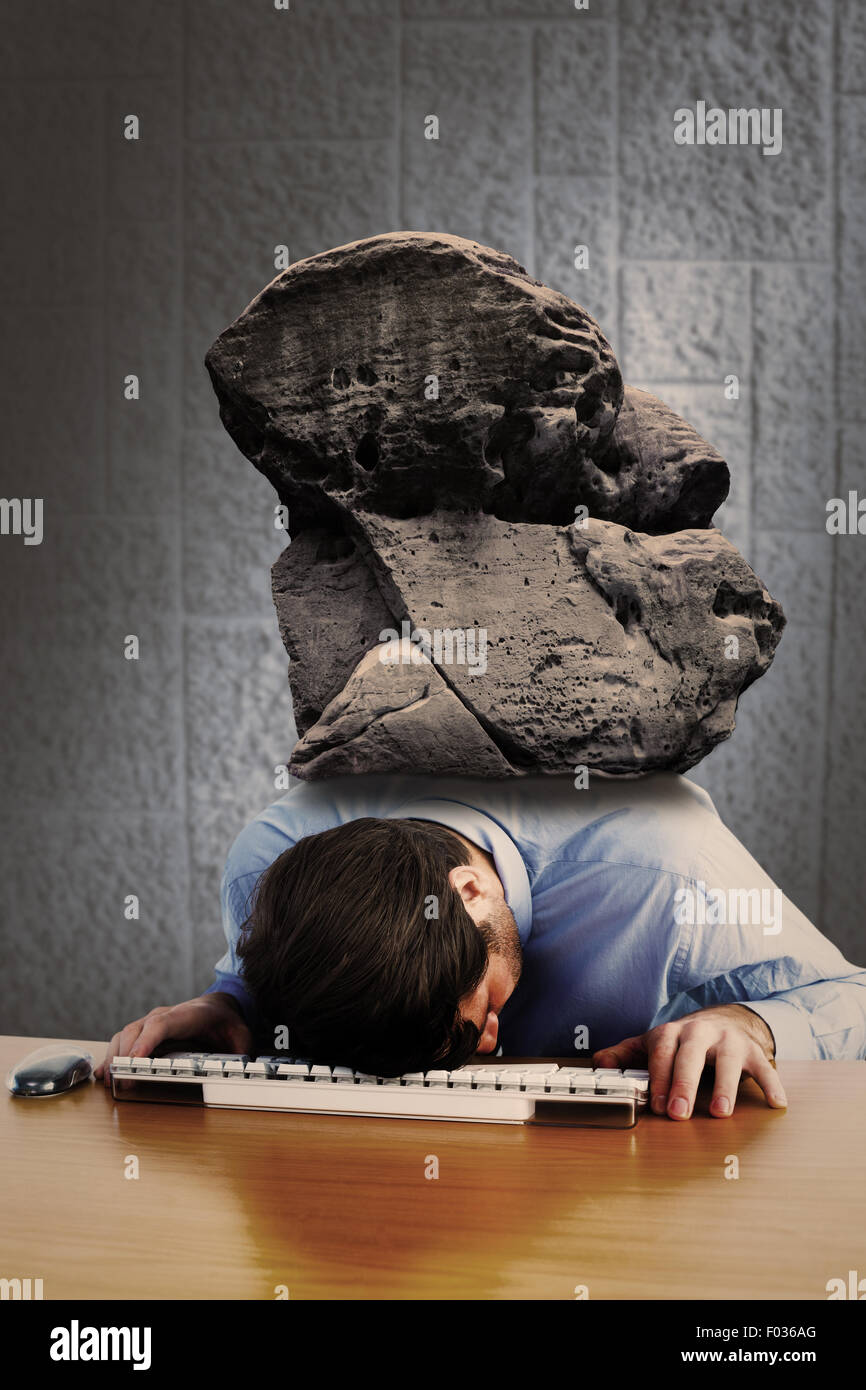 Composite image of businessman sleeping on his keyboard Stock Photo - Alamy