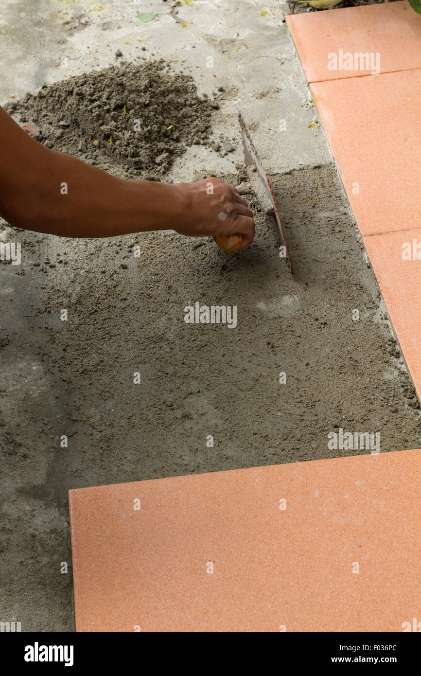 Tiler work bonding floor tile hi-res stock photography and images - Alamy