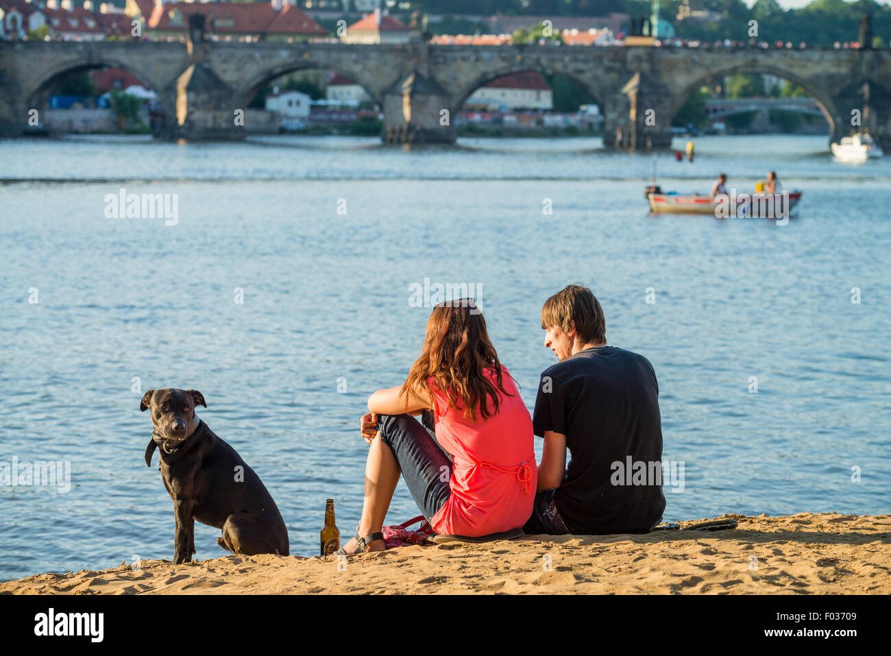 people enjoying summer strelecky island beach - old town in background ...