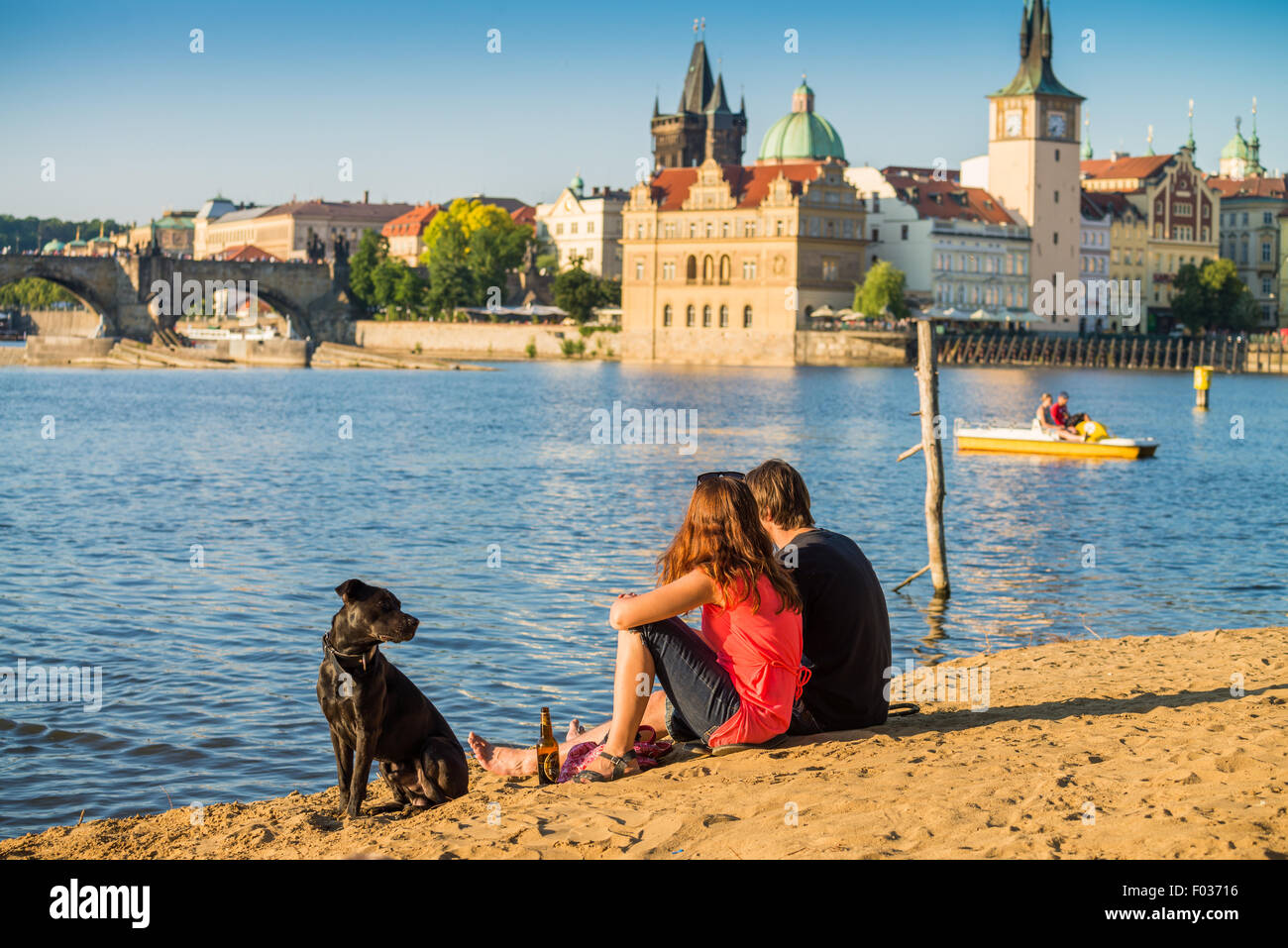 people enjoying summer strelecky island beach - old town in background ...