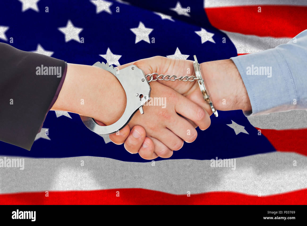 Composite image of business people in handcuffs shaking hands Stock ...