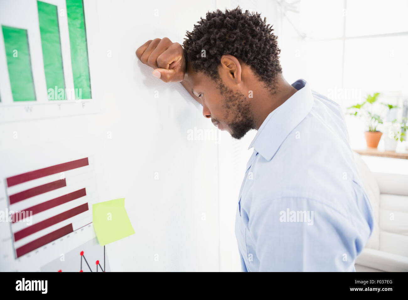 Businessman leaning wall eyes hi-res stock photography and images - Alamy