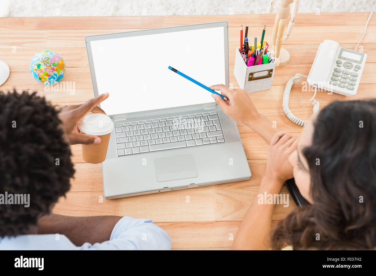 Woman pointing laptop man typing hi-res stock photography and images ...