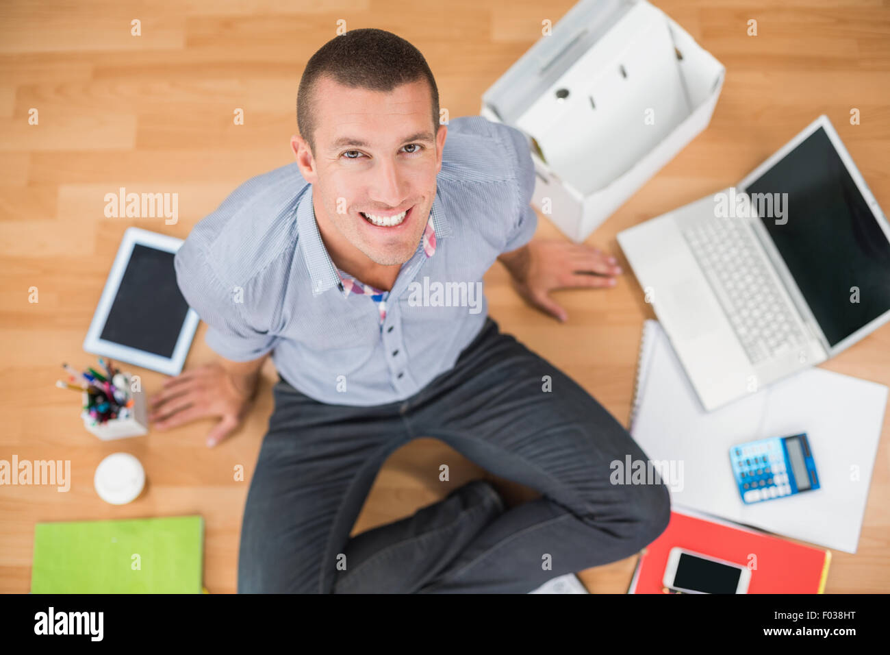 Young creative businessman looking at camera Stock Photo - Alamy