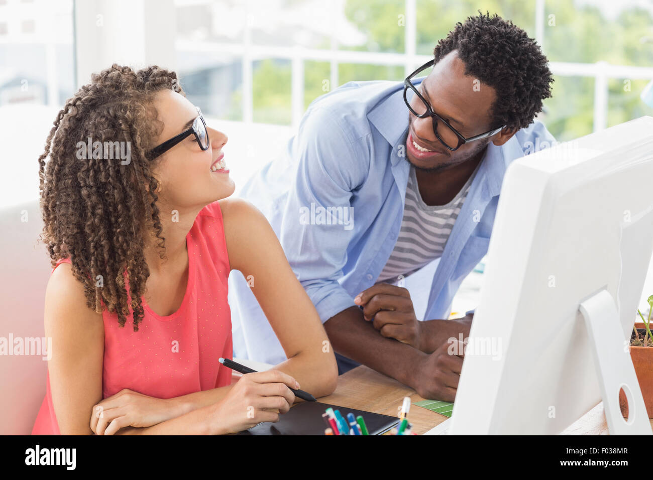 Two creative business colleagues talking together Stock Photo - Alamy Two creative business colleagues talking together Stock Photo - Alamy