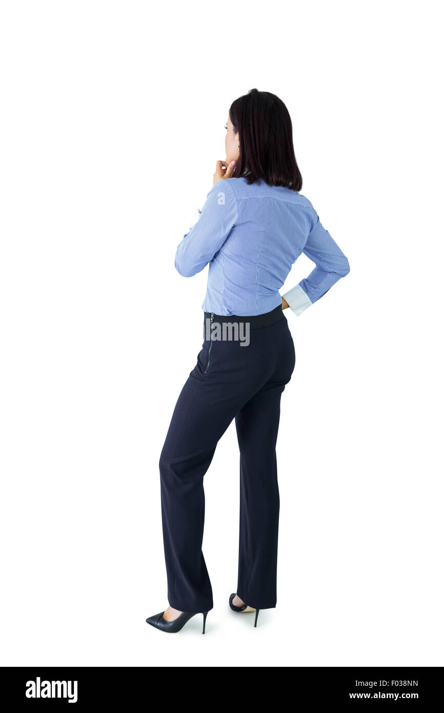 Businesswoman standing and thinking Stock Photo - Alamy