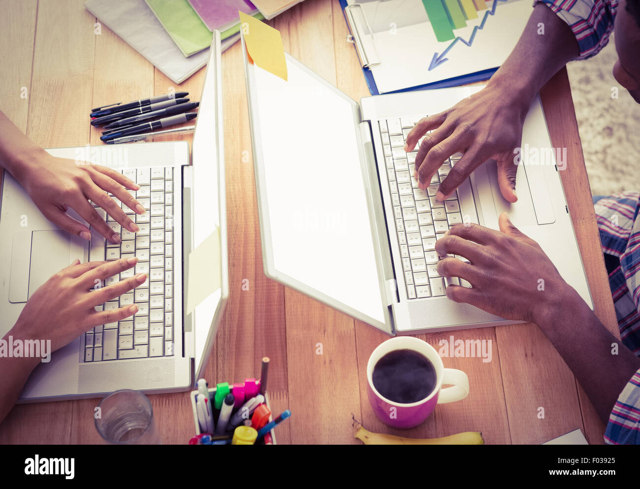 Young business people working at the laptops Stock Photo - Alamy