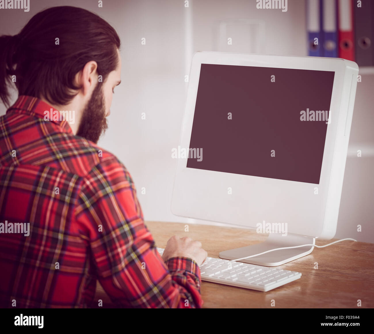 Hipster businessman working on his computer Stock Photo - Alamy