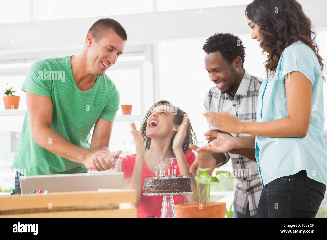 Smiling young professional celebrating hi-res stock photography and ...