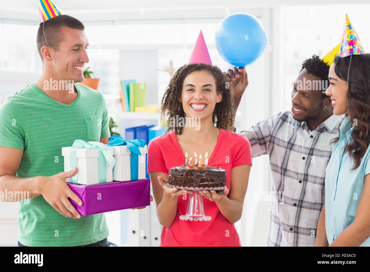 Casual business team celebrating a birthday Stock Photo - Alamy