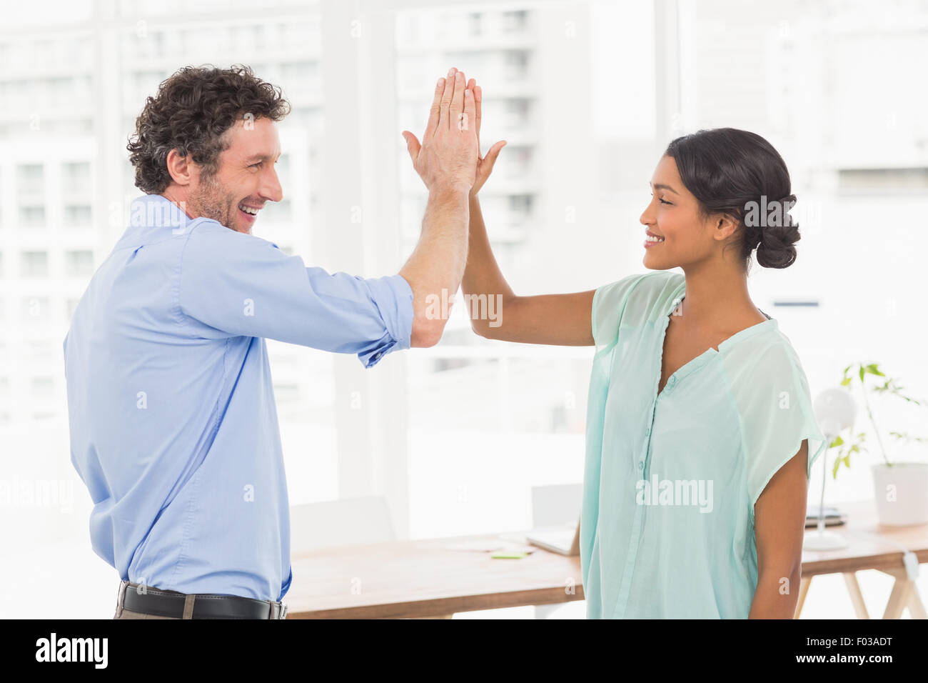 Office workers high five casual hi-res stock photography and images - Alamy