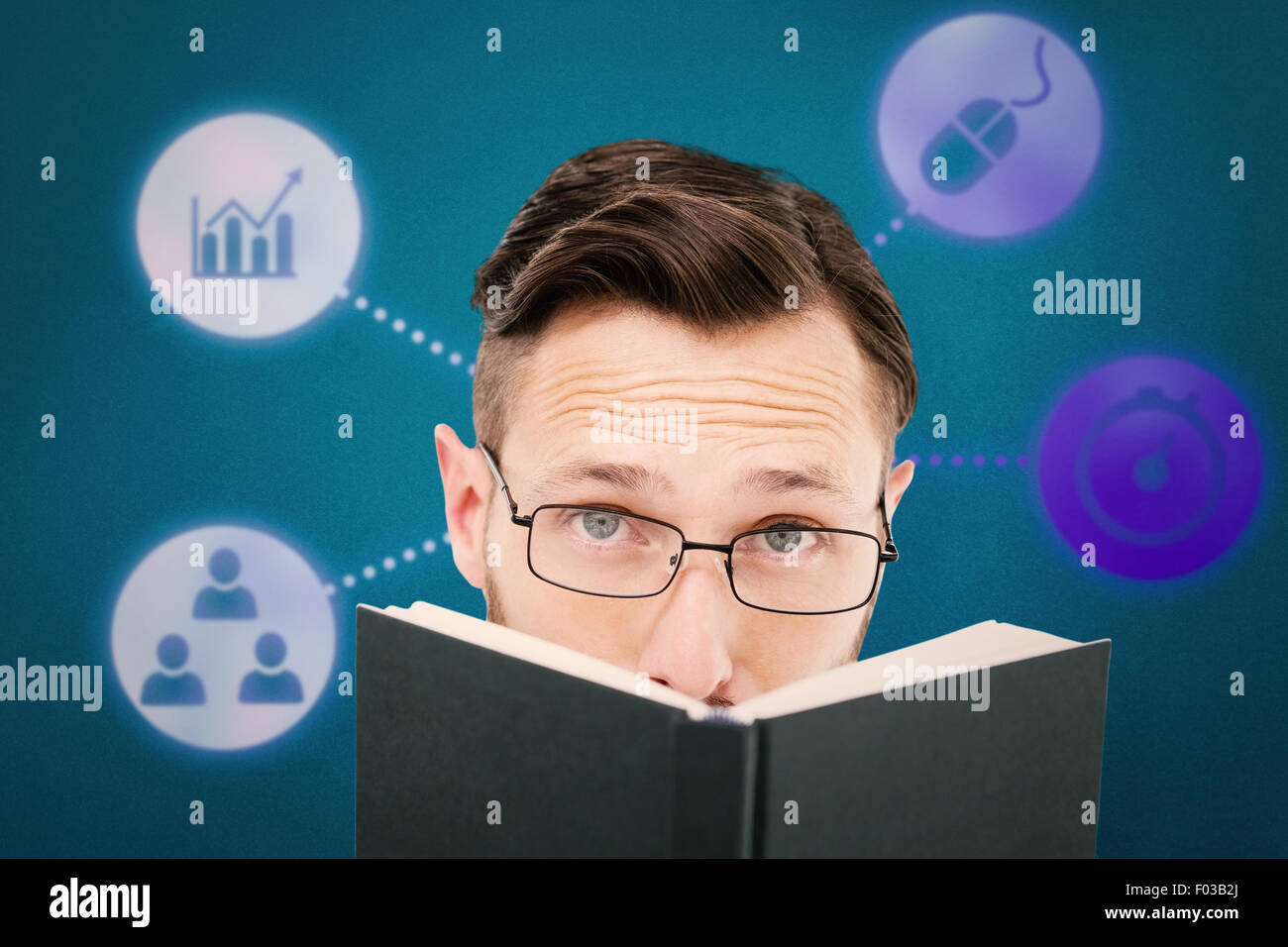 Composite image of young geek looking over black book Stock Photo - Alamy