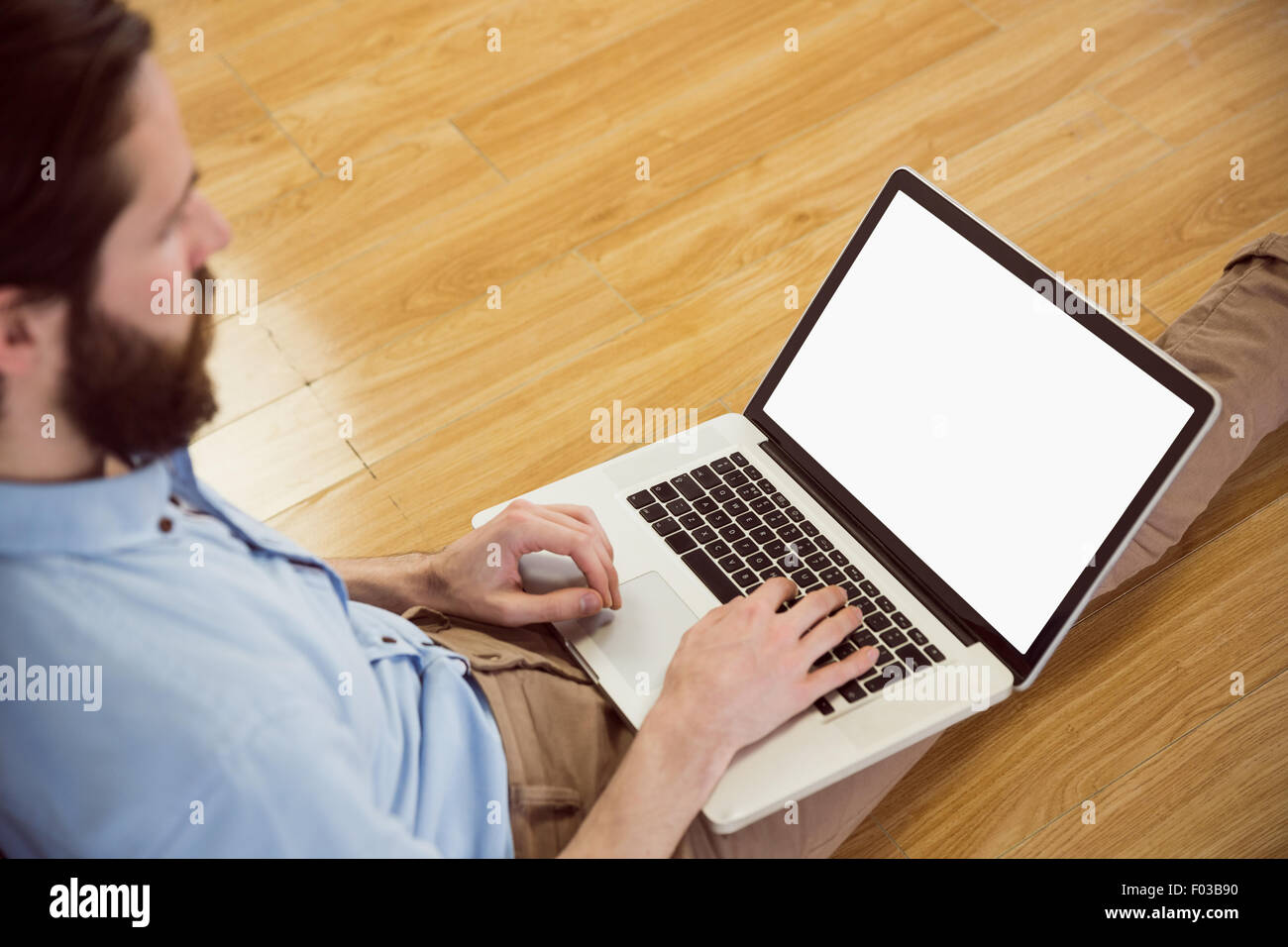 Handsome hipster using his laptop Stock Photo - Alamy