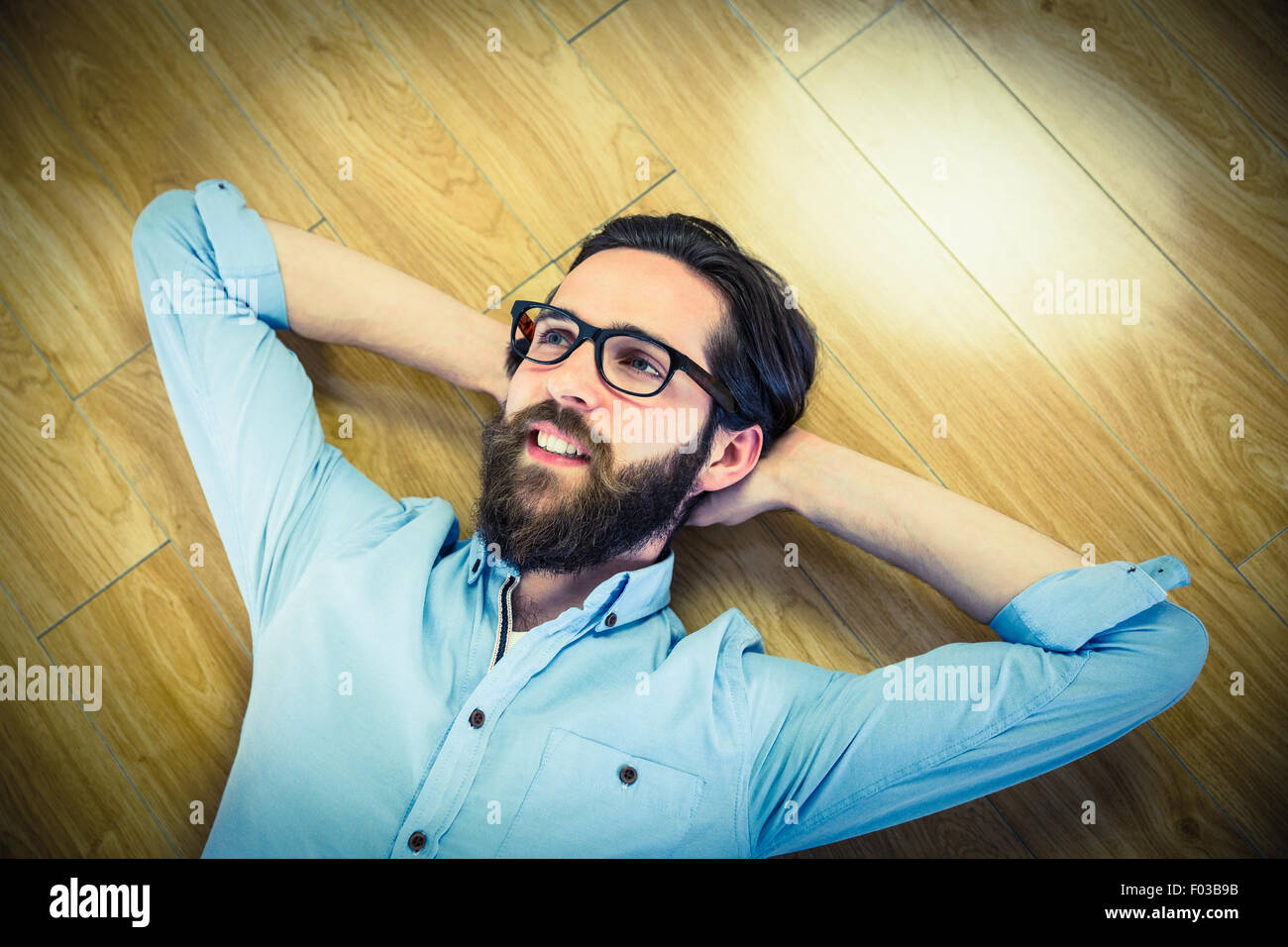 Handsome hipster lying and smiling Stock Photo - Alamy