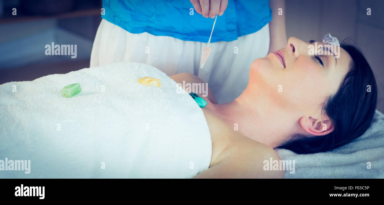 Young woman at crystal healing session Stock Photo - Alamy