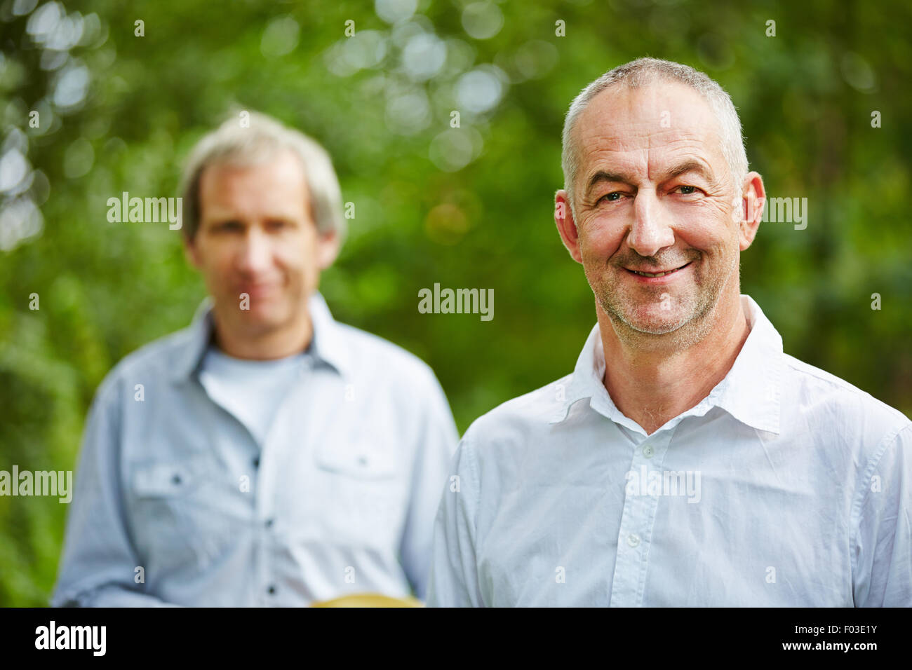 Two senior men together in summer in nature Stock Photo - Alamy