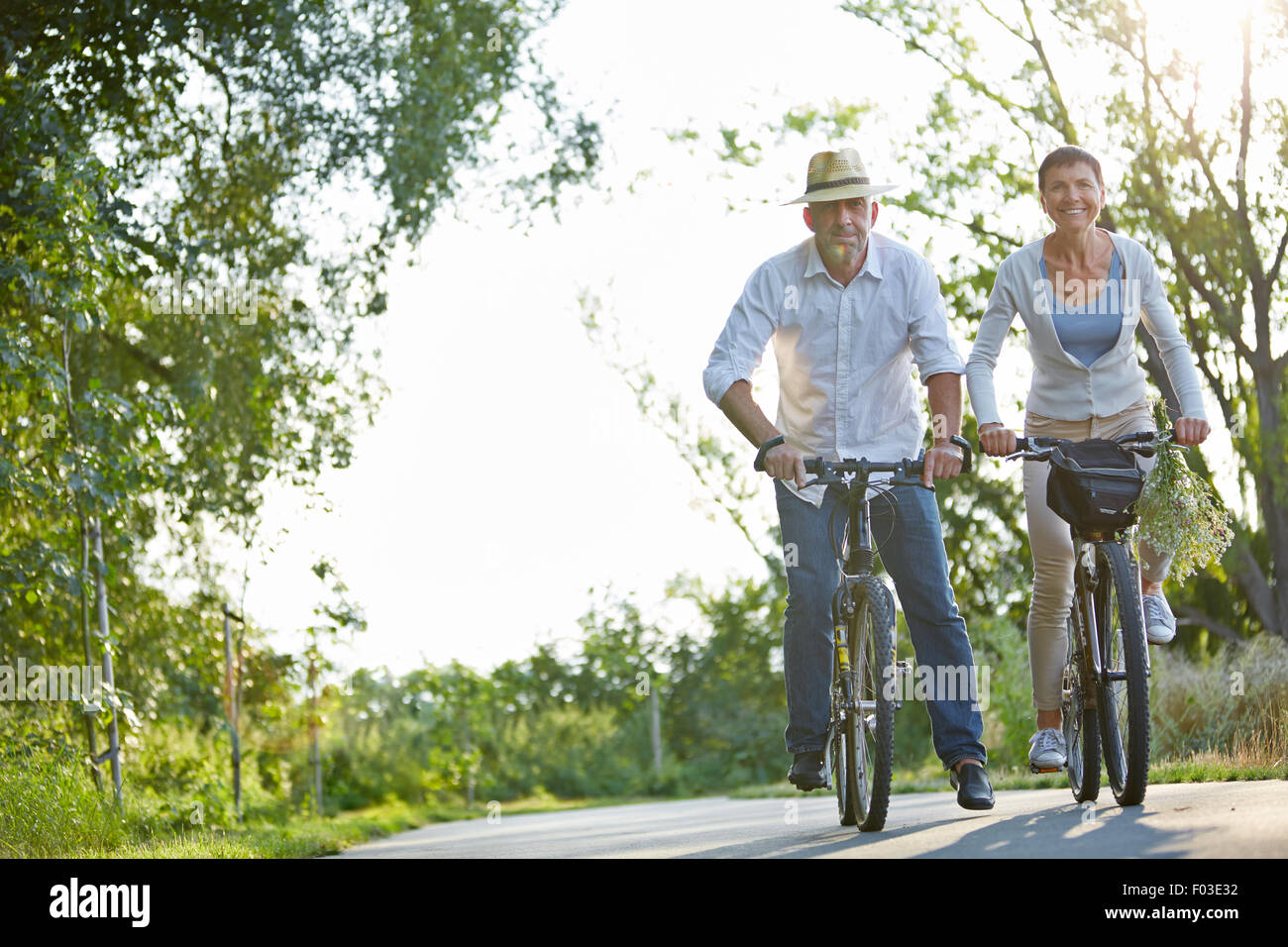 Senior citizens riding bike hi-res stock photography and images - Alamy