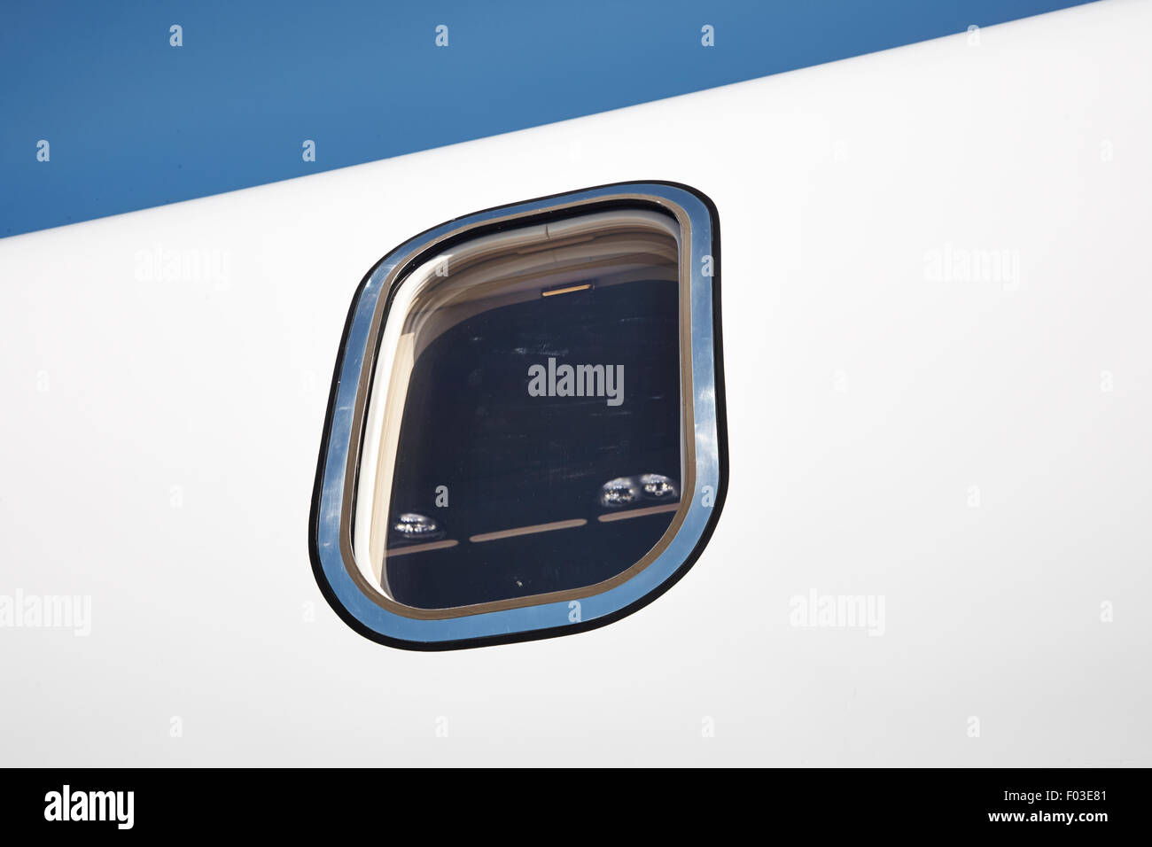 The passenger window of private jet Stock Photo - Alamy