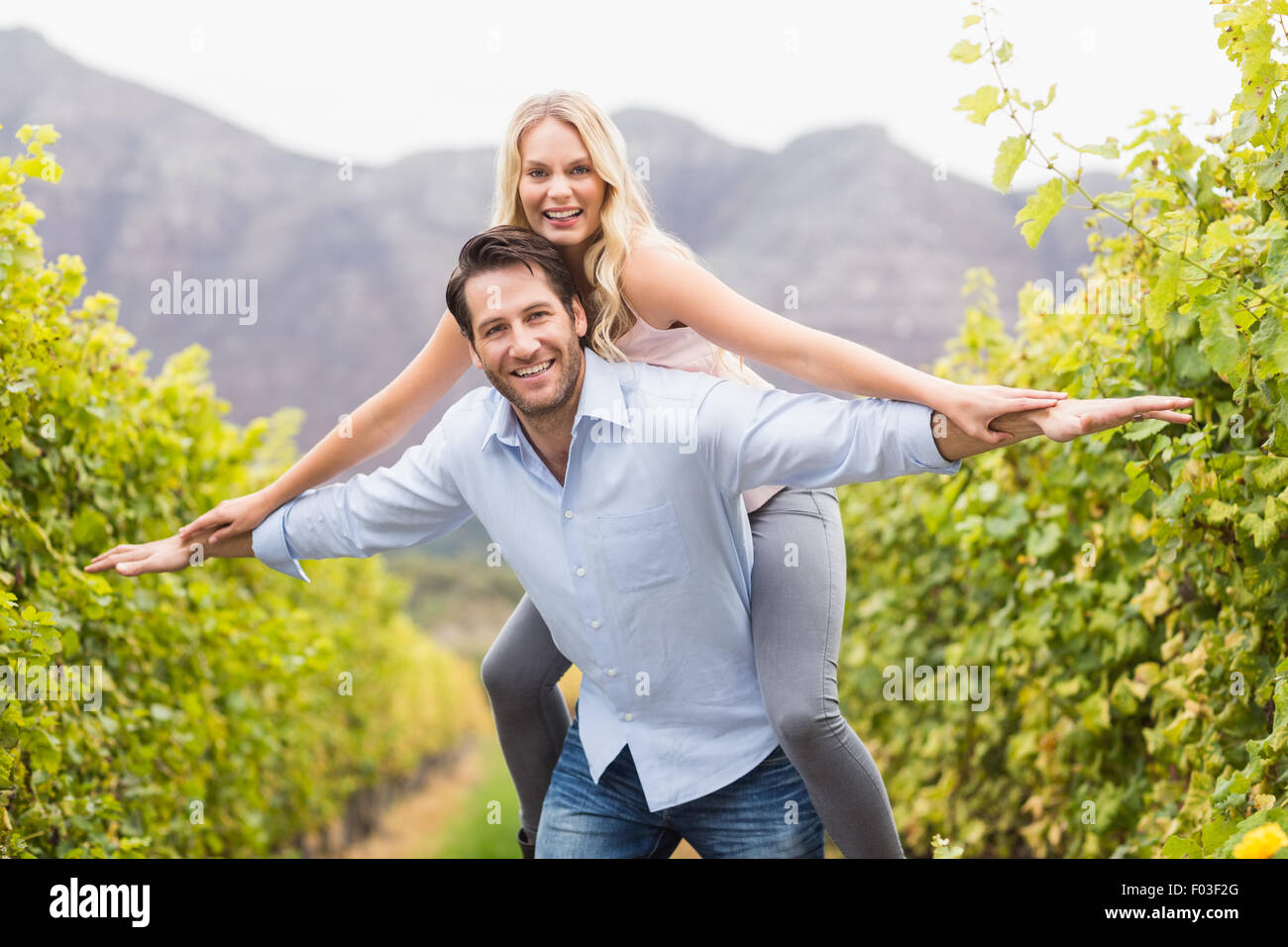 Woman carrying man on her back hi-res stock photography and images - Alamy