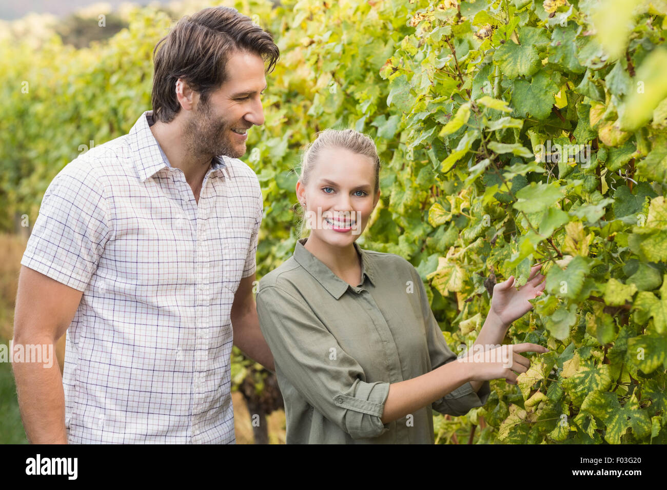 Two young happy vintners looking at camera Stock Photo - Alamy