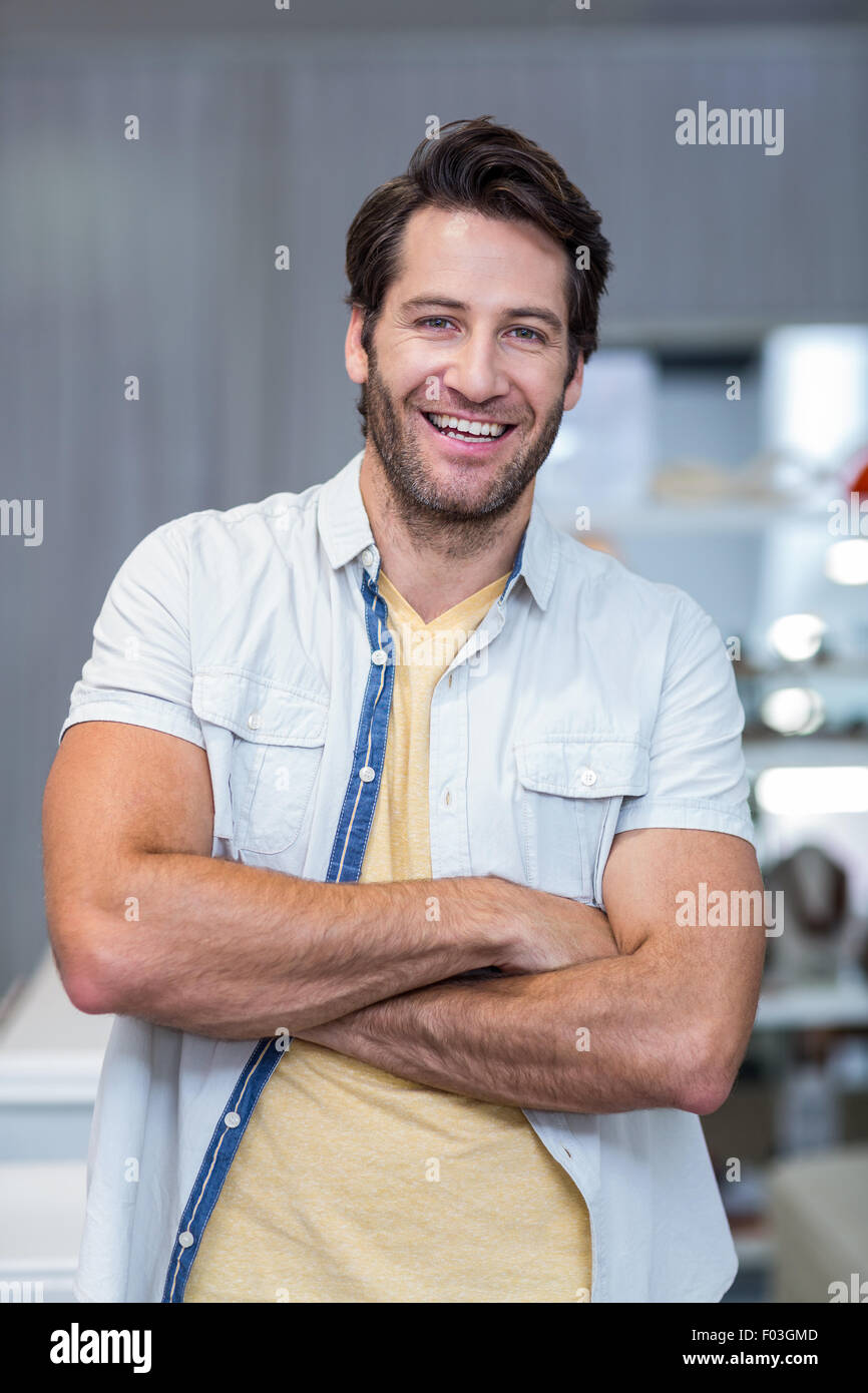 Smiling man with arms crossed Stock Photo - Alamy