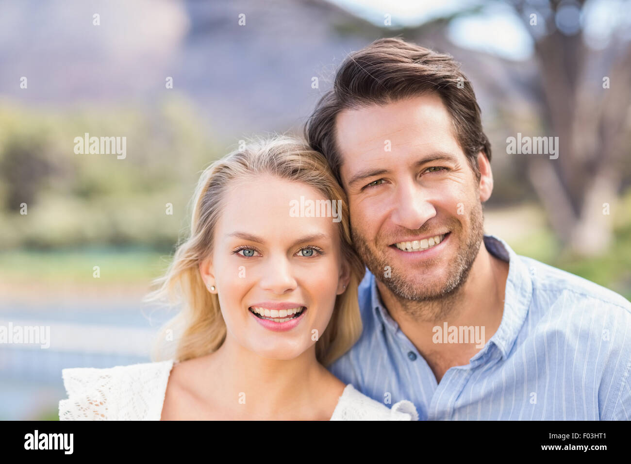 Cute couple on date looking at the camera Stock Photo - Alamy