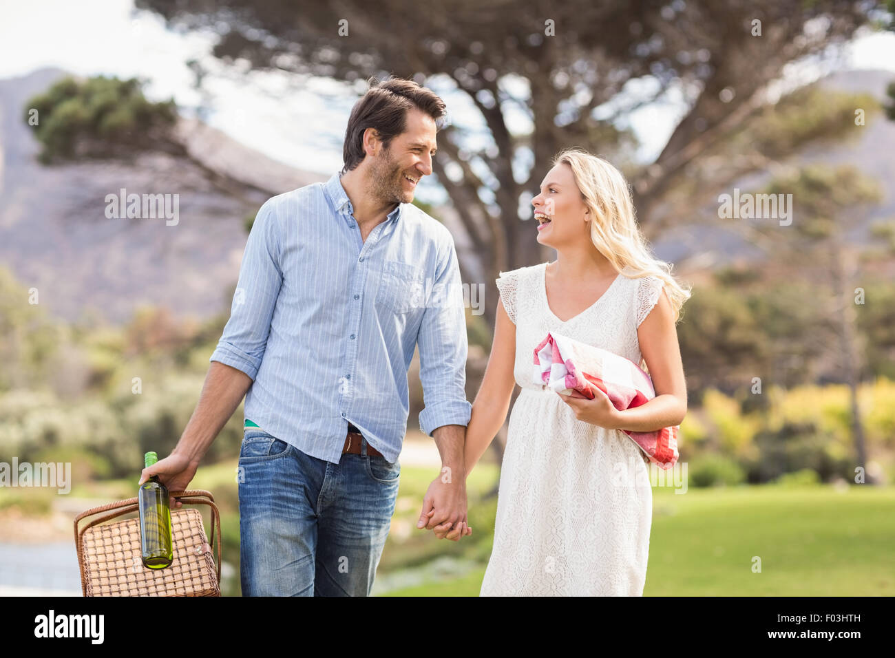 Cute couple on date walking in the park Stock Photo - Alamy