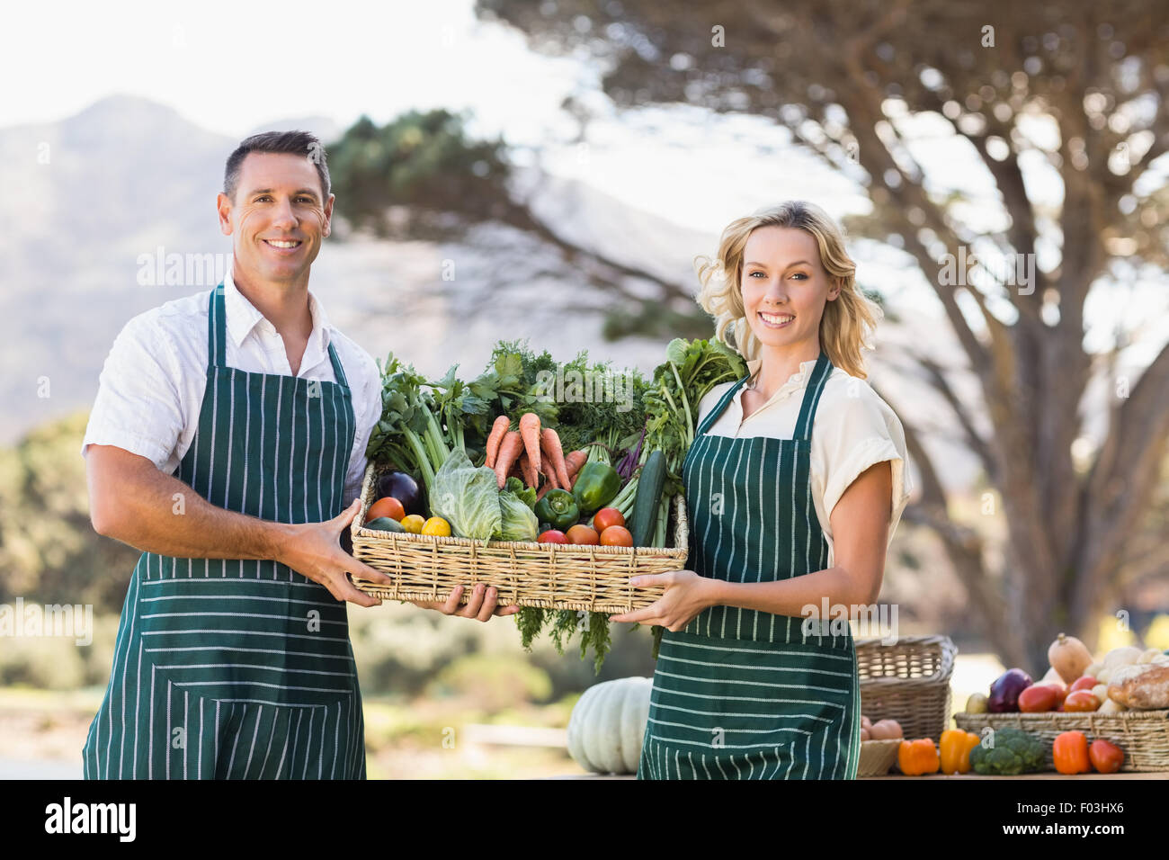 Smiling farmer holding vegetable hi-res stock photography and images ...